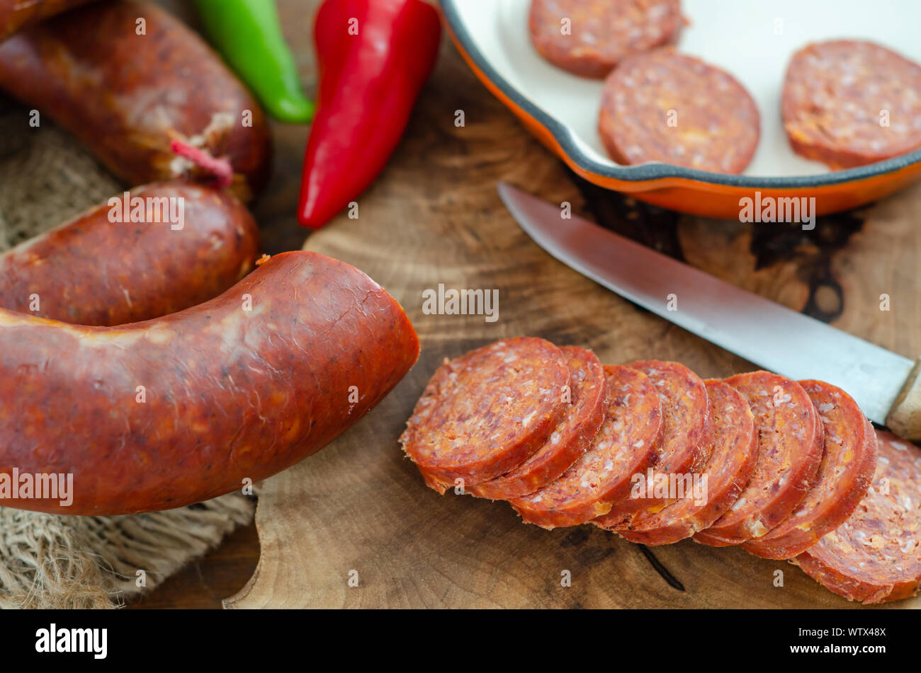 Turkish sausage sucuk on a cutting board,close up Stock Photo - Alamy