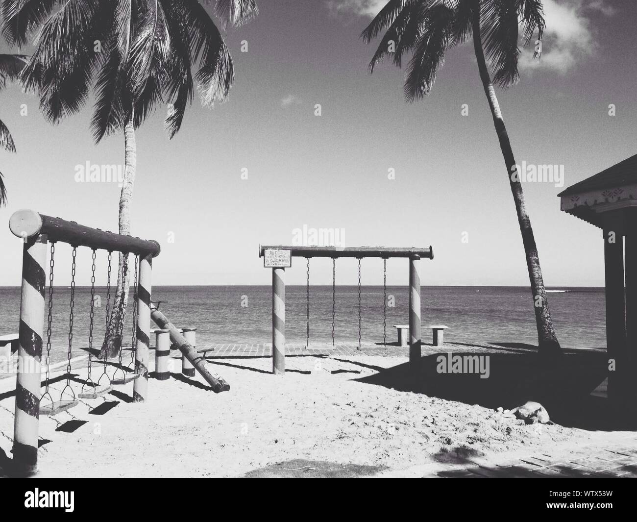 Swings on a beach hi-res stock photography and images - Alamy