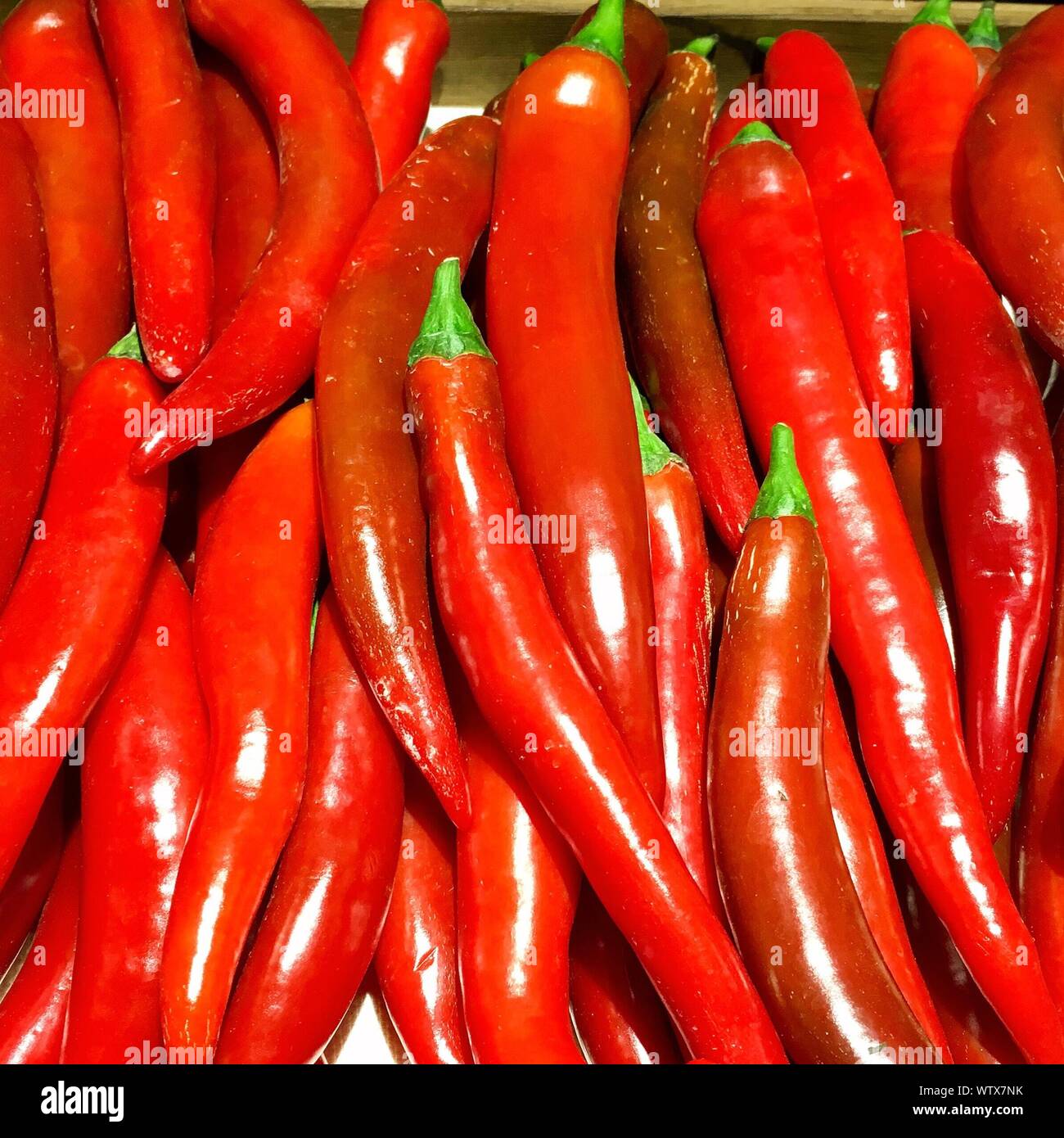 Group of shiny red peppers hi-res stock photography and images - Alamy