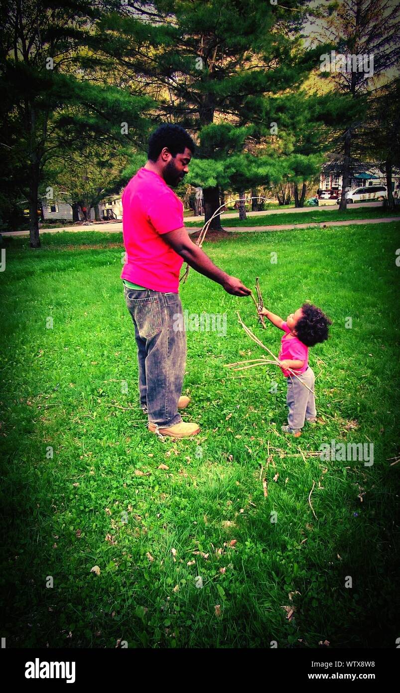 Boys holding sticks hi-res stock photography and images - Alamy