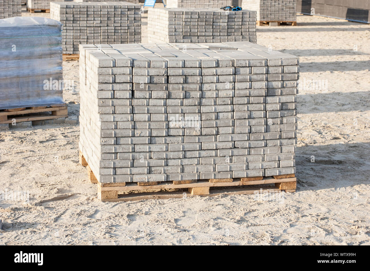 Paving grey slabs fot pavement construction in city. Gray concrete ...