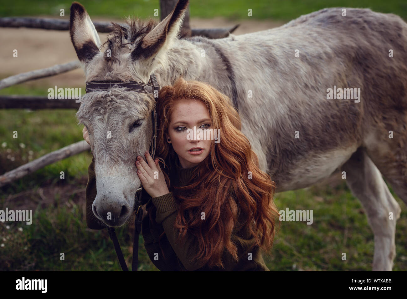 A girl with curly red hair in fashionable clothes in the style of ...