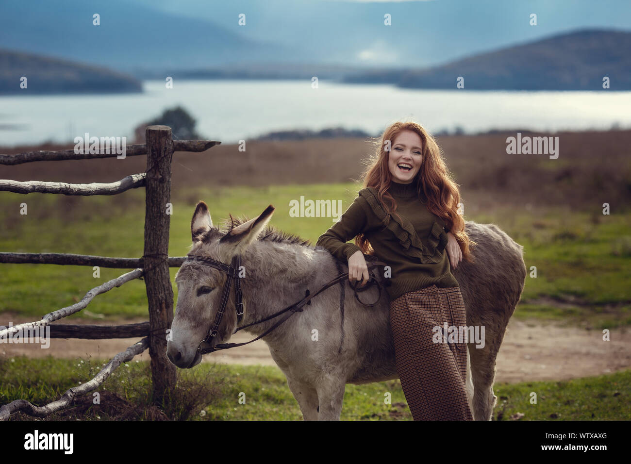 A girl with curly red hair in fashionable clothes in the style of ...