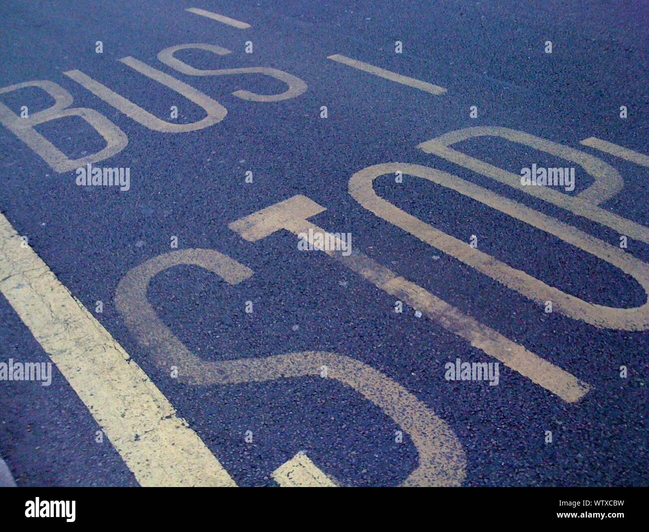 Bus stop marking on road hi-res stock photography and images - Alamy