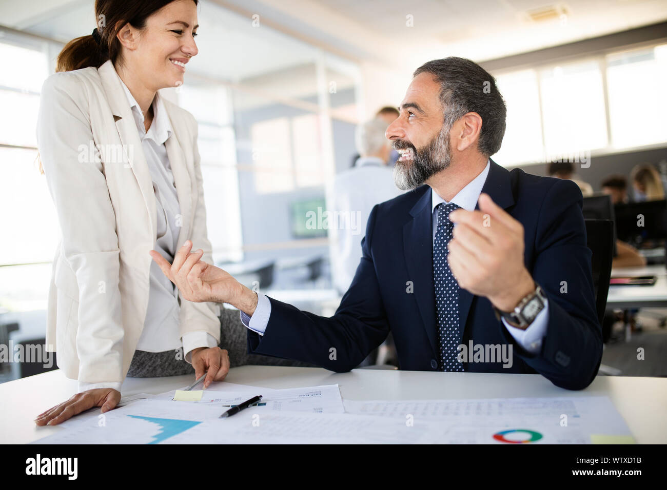 Portrait of architects having discussion in office Stock Photo - Alamy