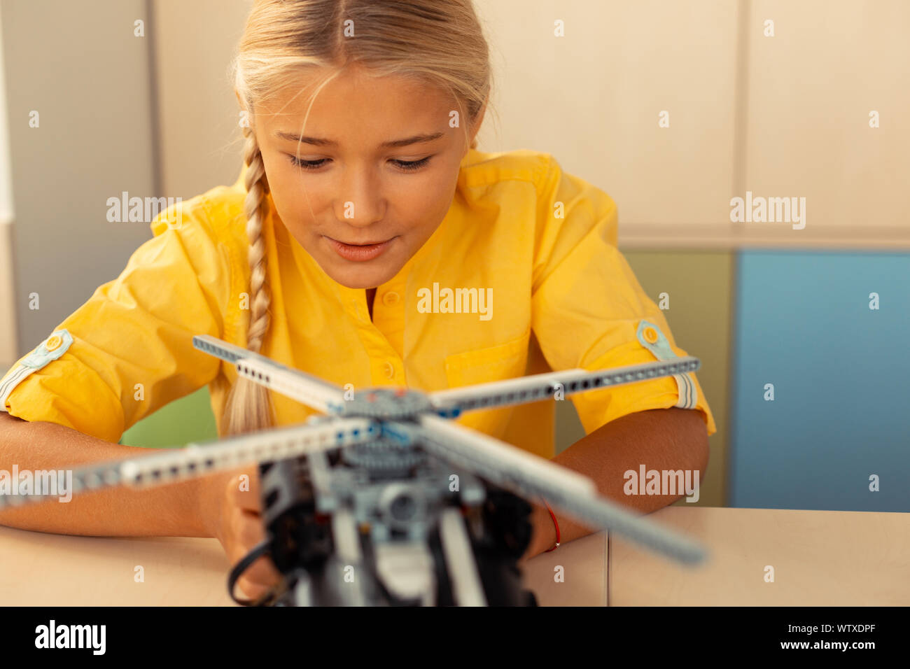 School girl beginning launching a helicopter model Stock Photo - Alamy