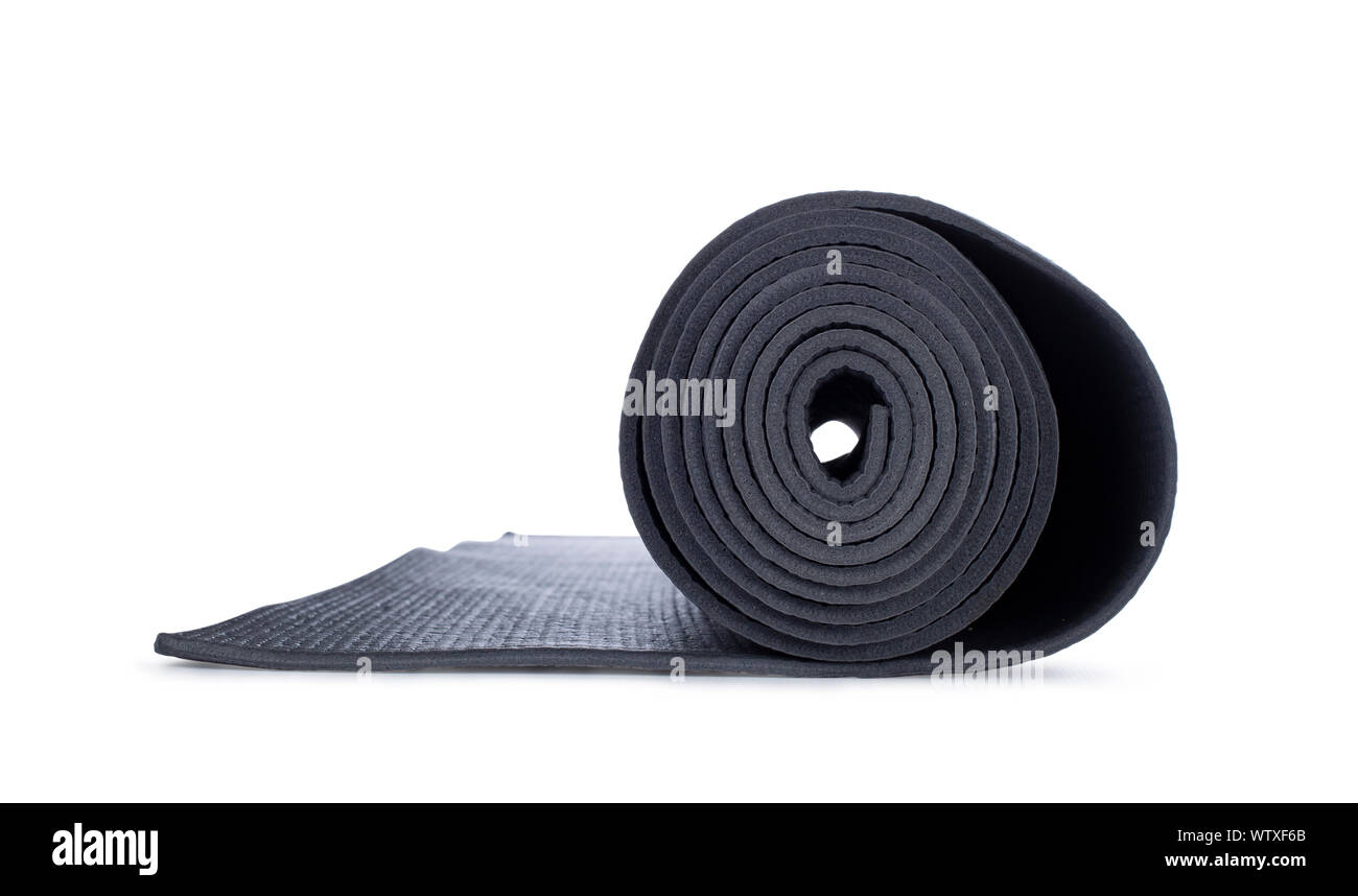 Close up studio shot of rolled op yoga mat, side view. Isolated on ...