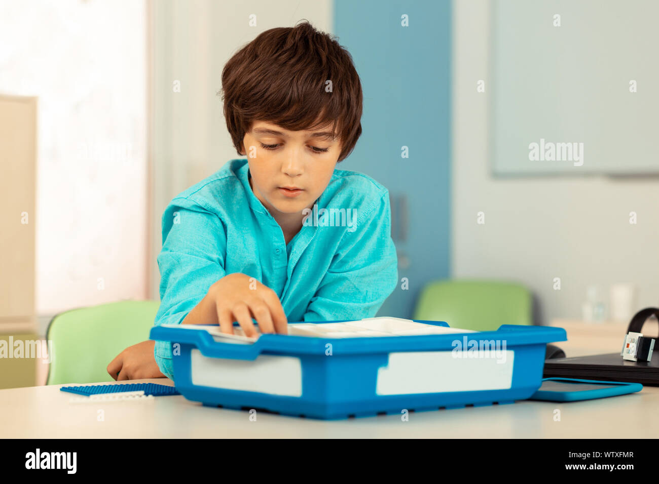 Thoughtful boy going to make new school project Stock Photo - Alamy