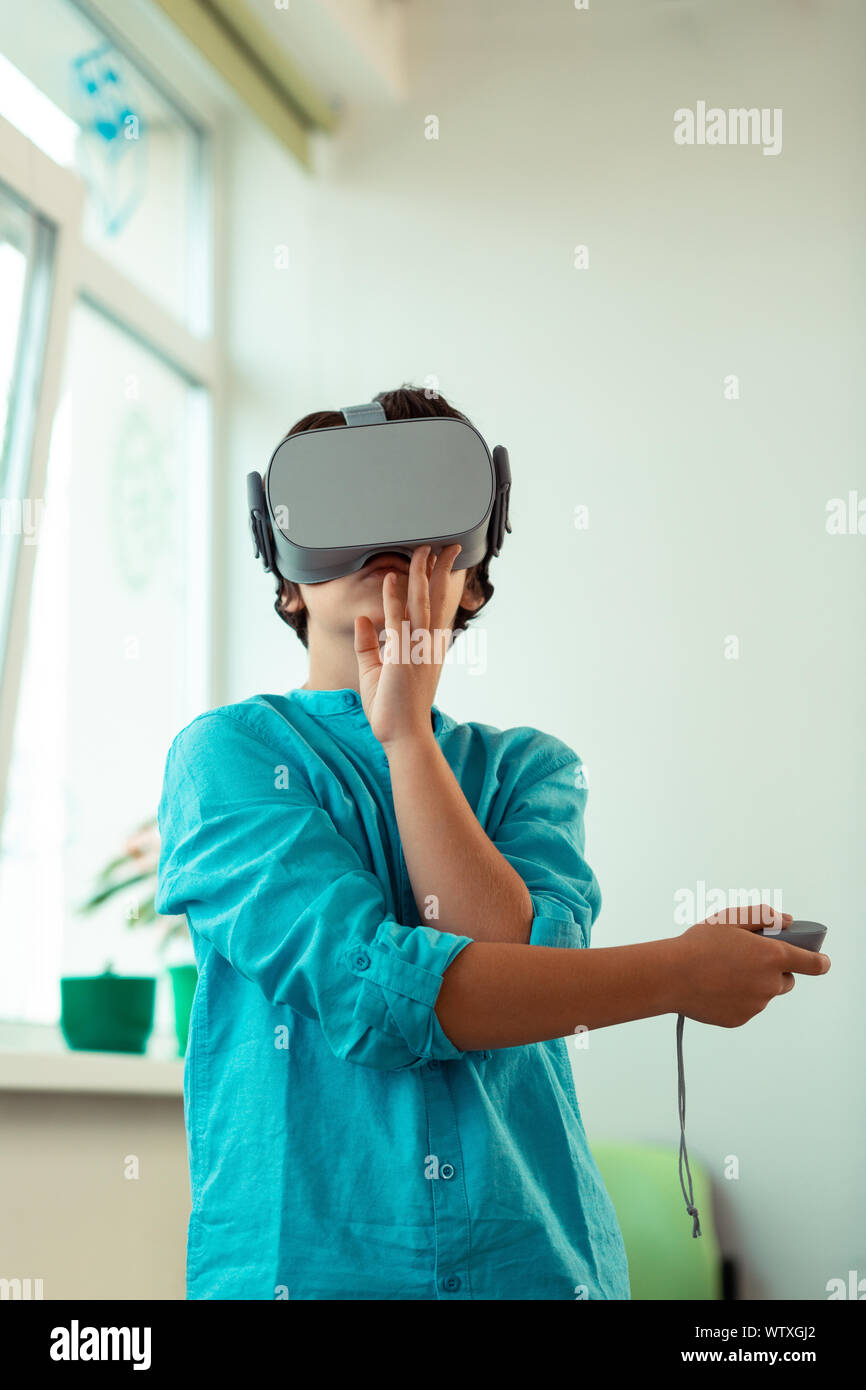 Pupil playing virtual games at school lesson Stock Photo - Alamy