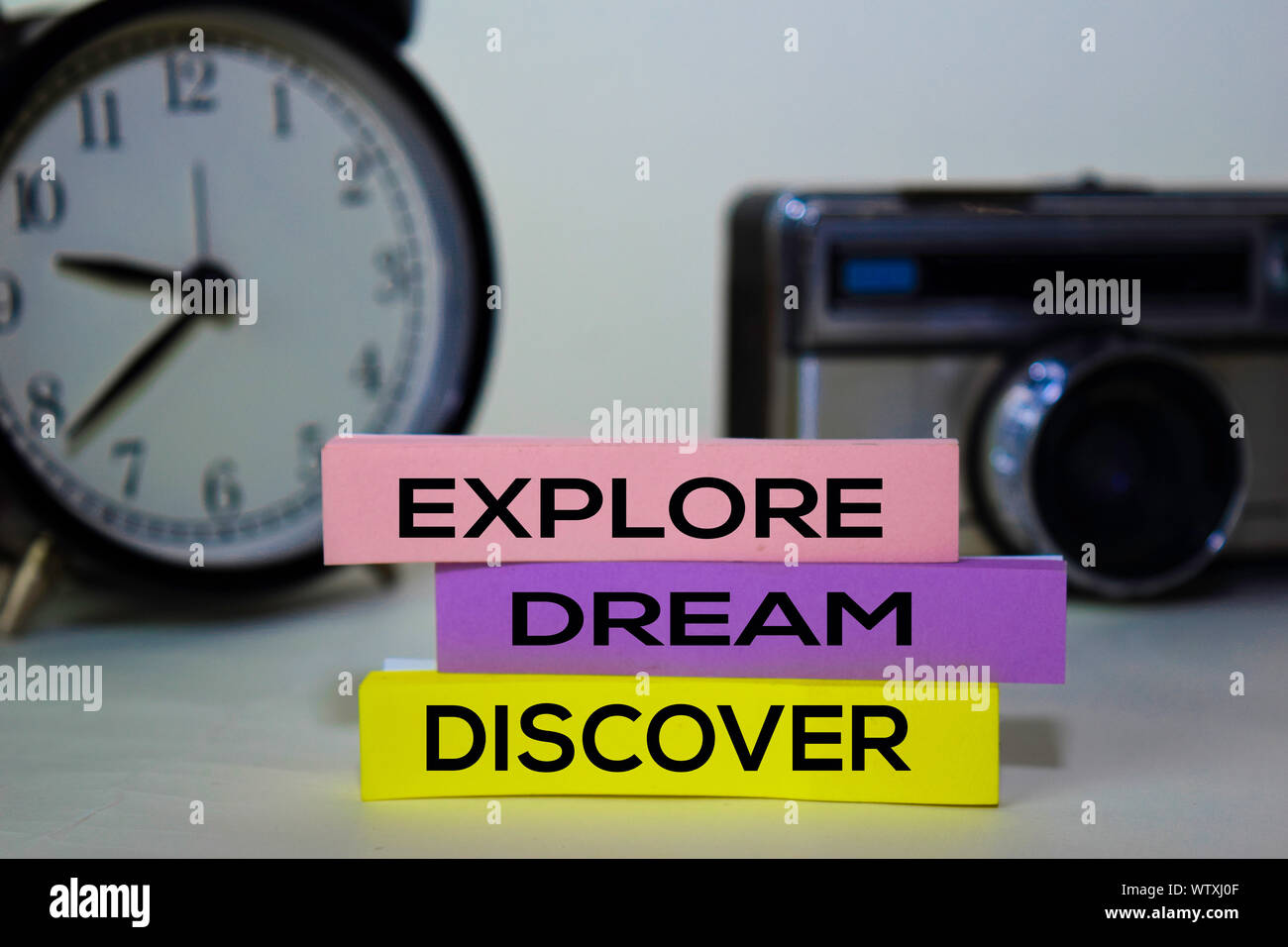Explore Dream Discover text on sticky notes isolated on desk background ...