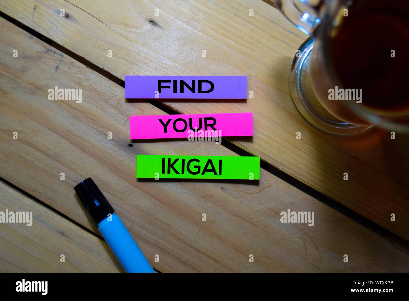 Find Your Ikigai text on sticky notes isolated on Table background ...