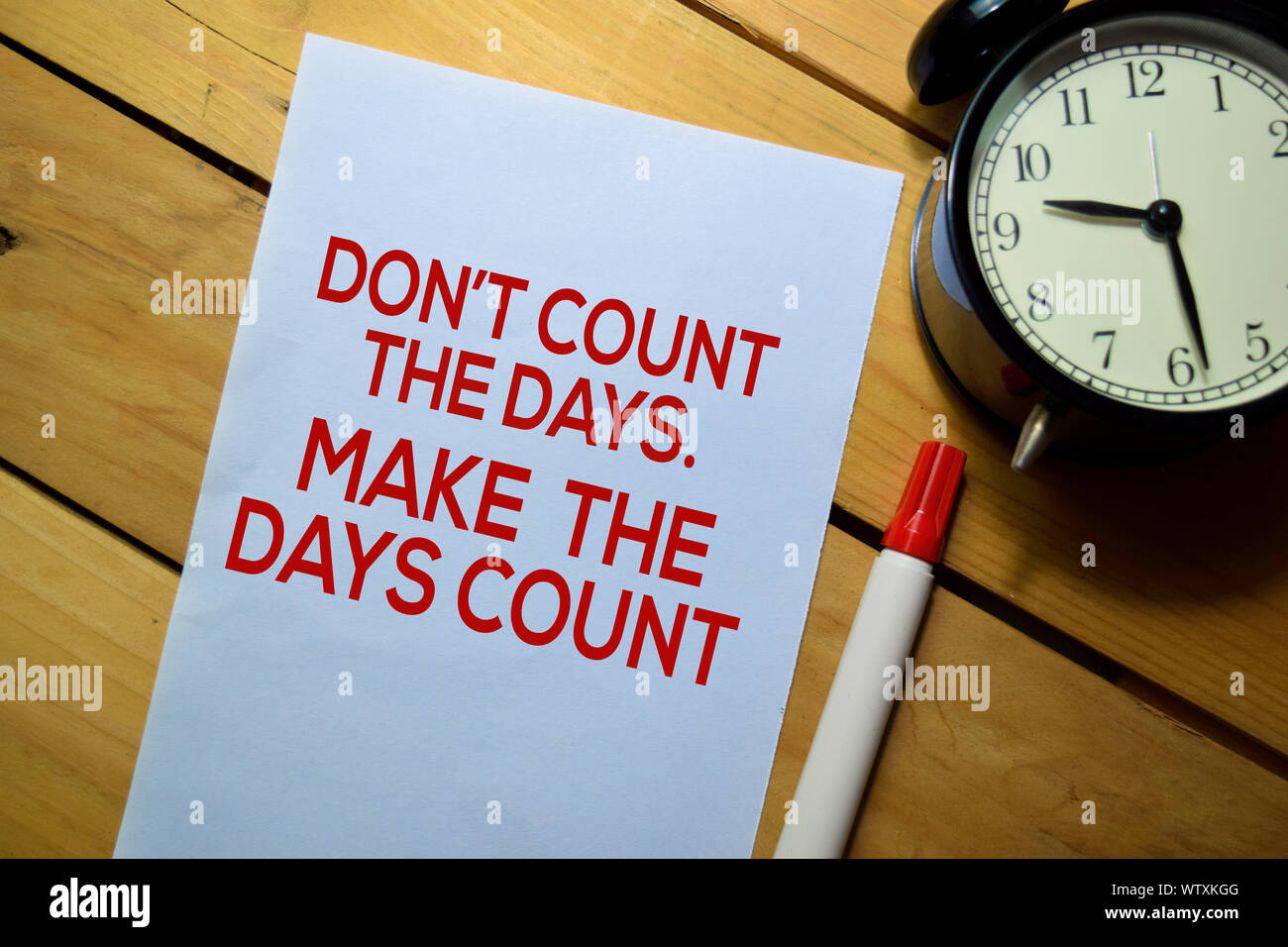 Don't Count The Days. Make The Days Count text on the paper isolated on ...