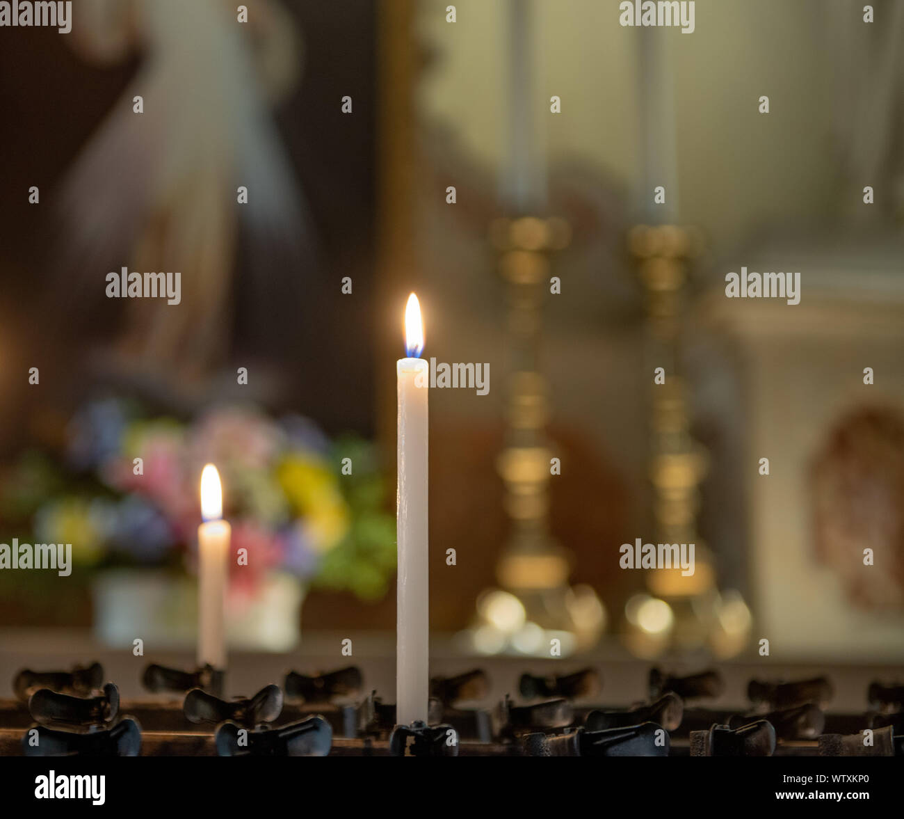 votive candle lit in the church Stock Photo - Alamy