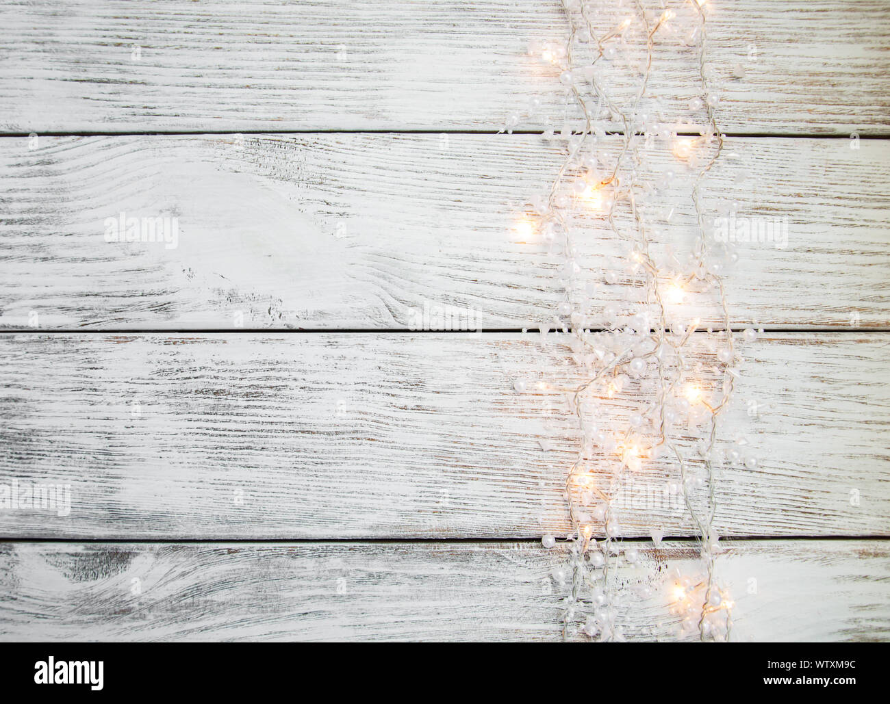 christmas garland lights on wooden rustic background Stock Photo - Alamy