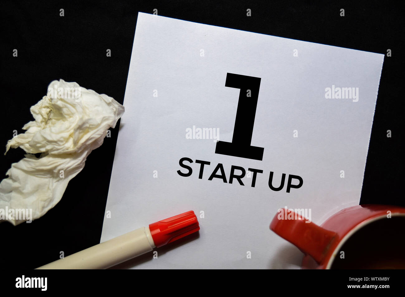 1 Start Up text on the paper isolated on office desk background Stock ...