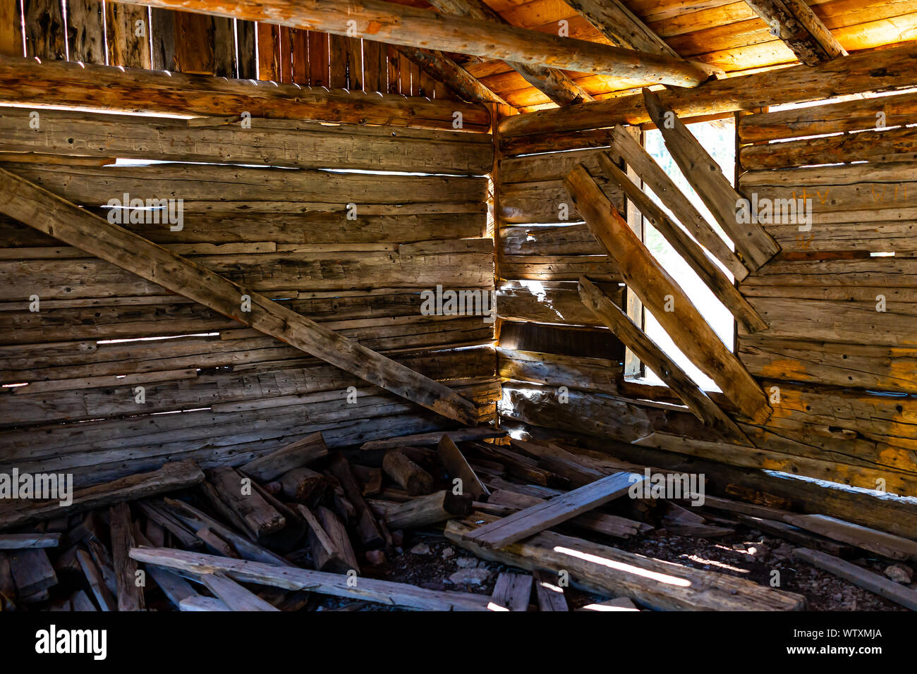 Independence Pass mining townsite wooden cabin interior with sunlight ...