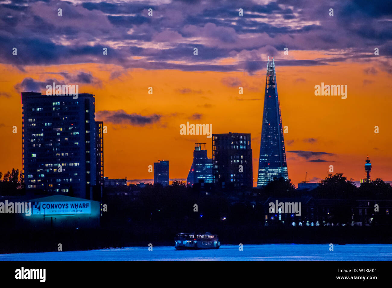 London, UK. 11th Sep, 2019. The sun sets behind the Shard as seen from ...