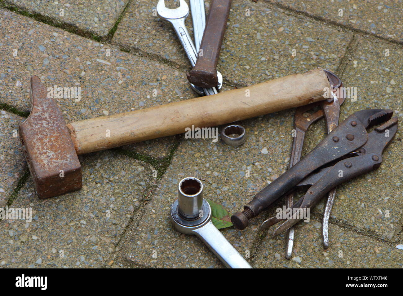 Tools on the ground of a backyard Stock Photo - Alamy