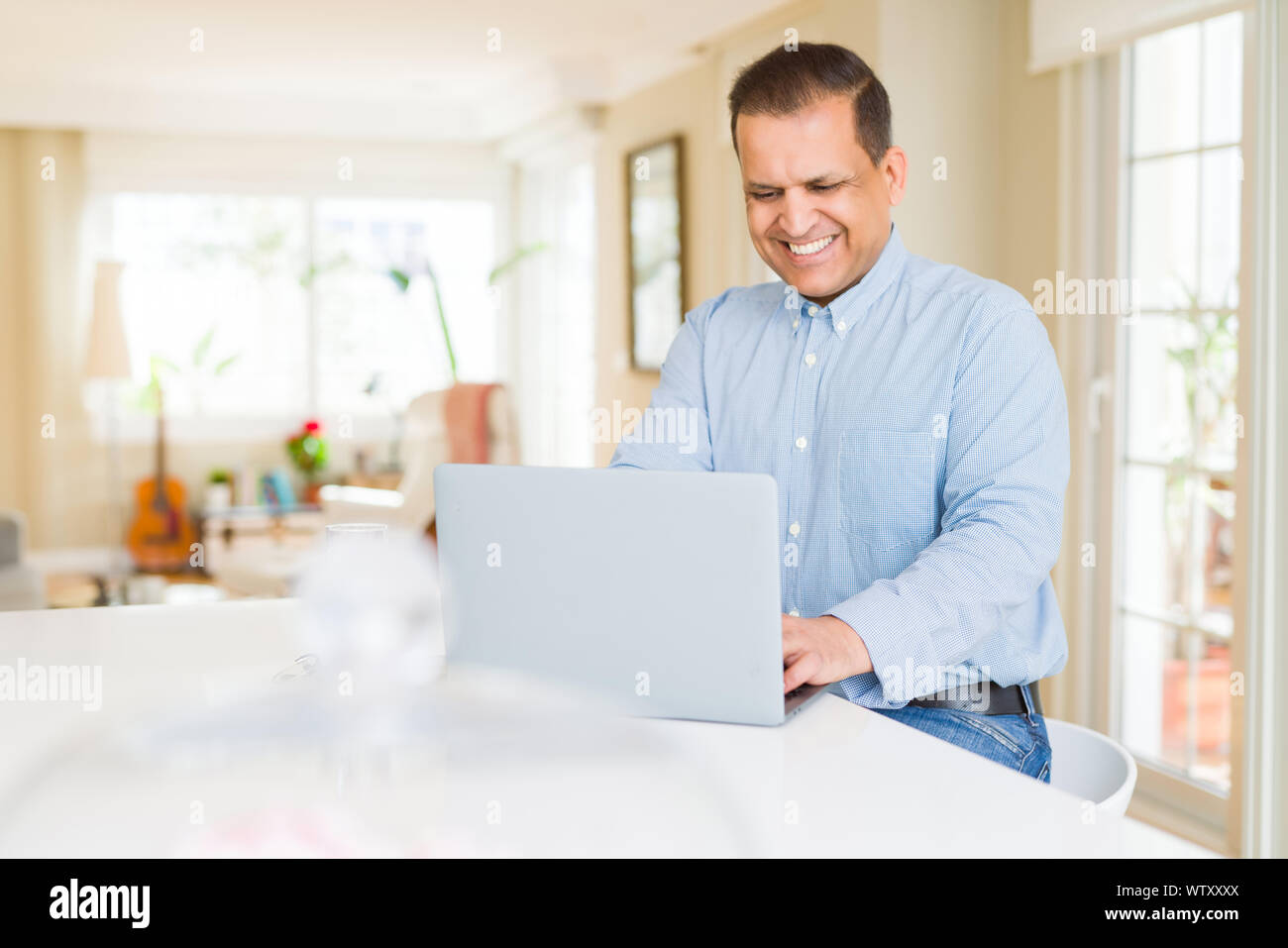 Middle age man using computer laptop Stock Photo - Alamy