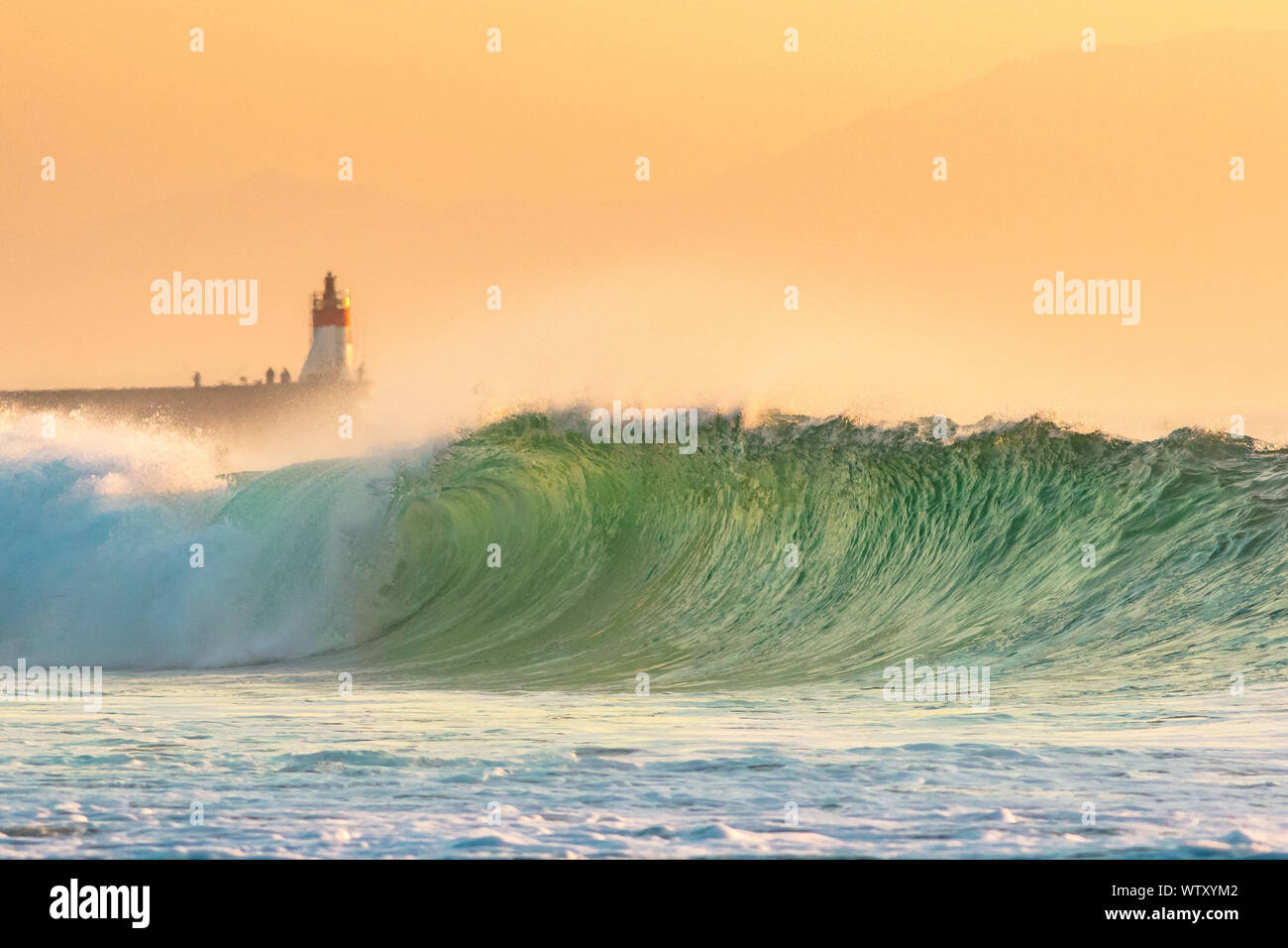 hossegor sunset beach, Green wave Stock Photo - Alamy