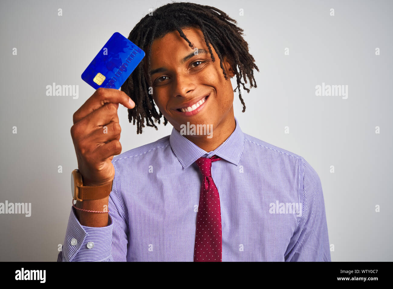 Afro american businessman with dreadlocks holding credit card over ...