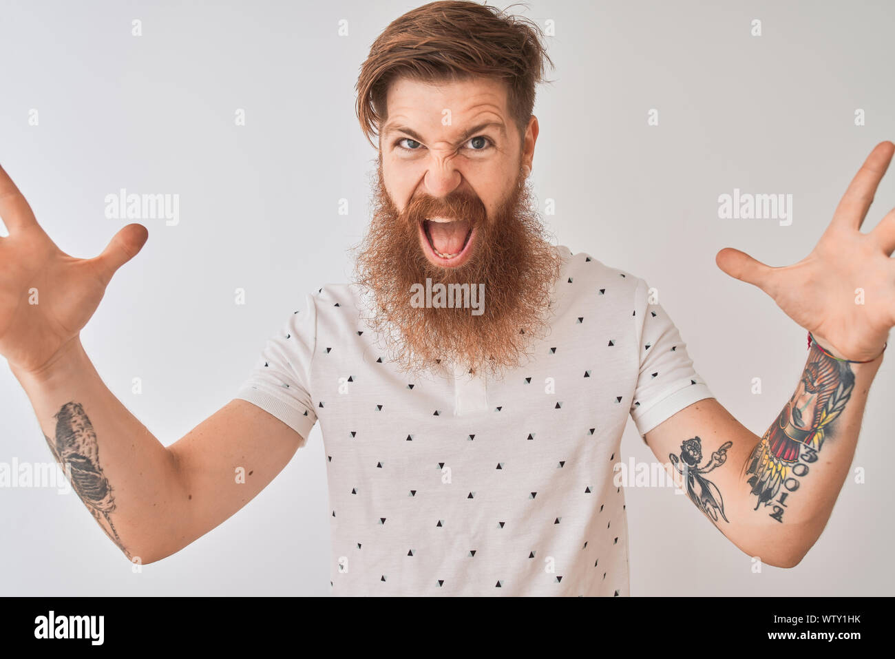 Young redhead irish man wearing polo standing over isolated white ...