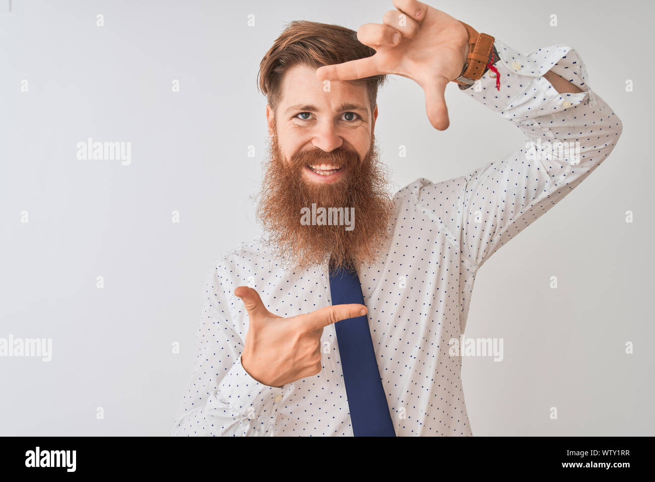 Young redhead irish businessman standing over isolated white background ...