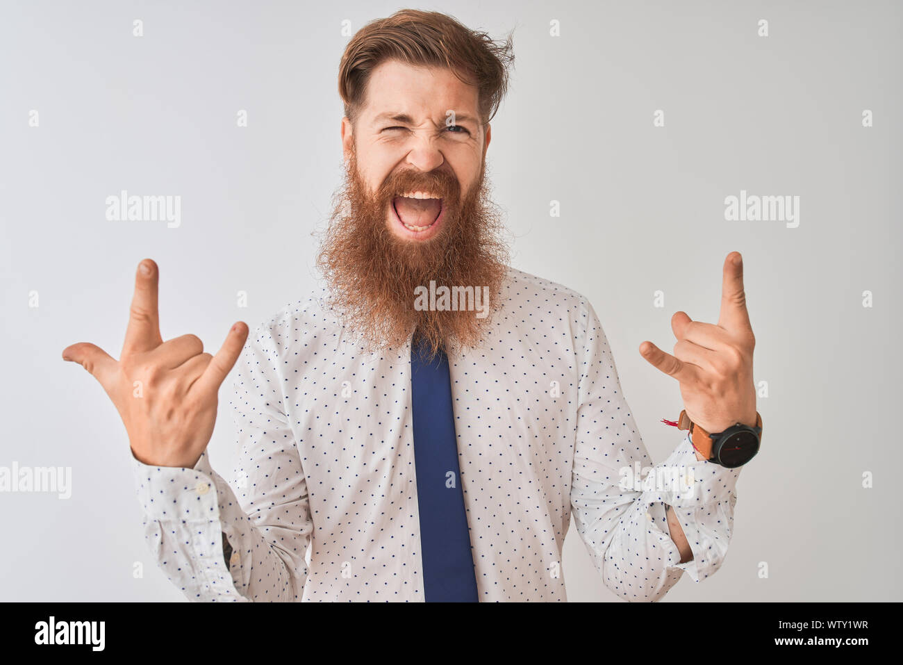 Young redhead irish businessman standing over isolated white background ...