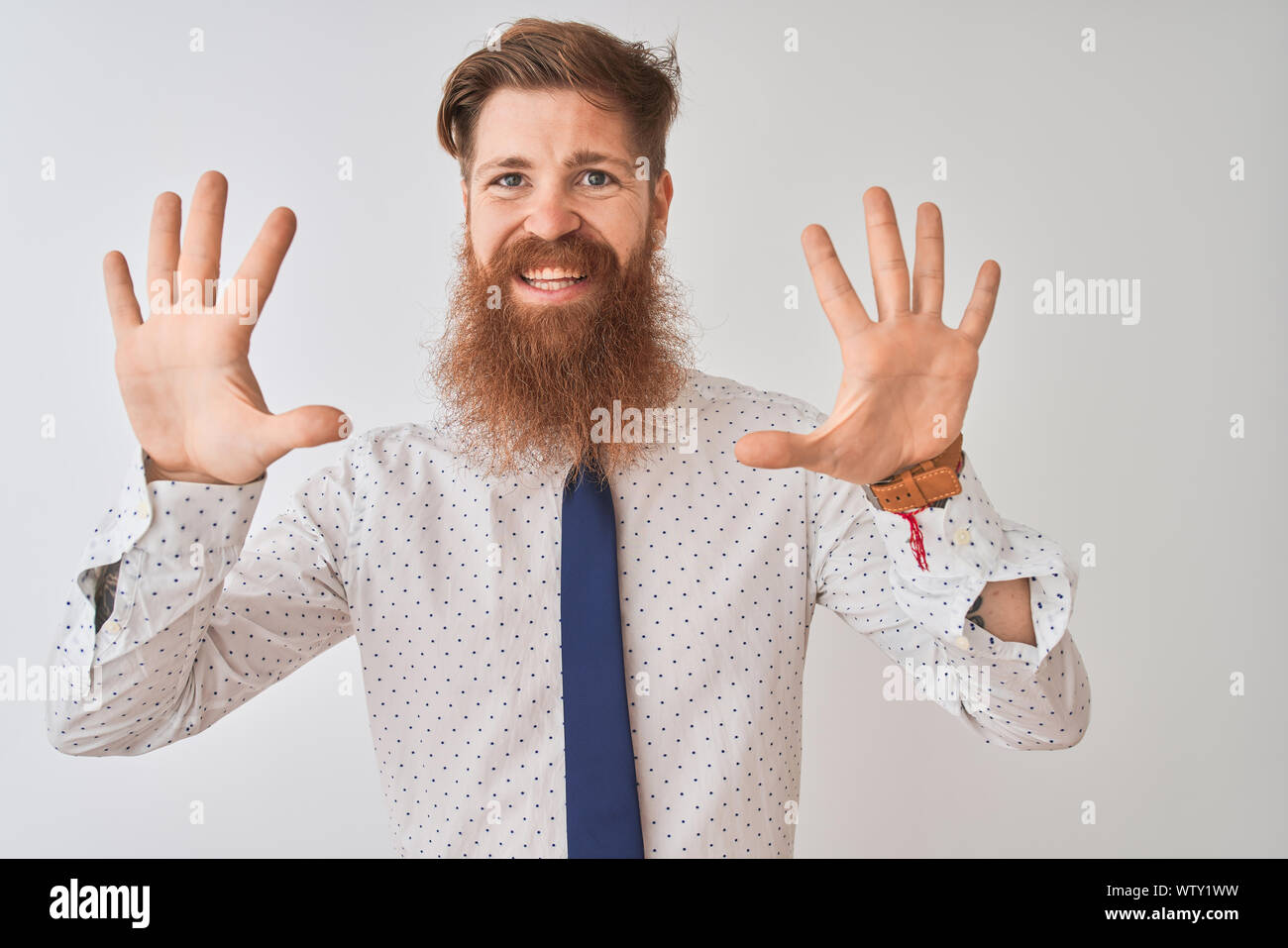 Young redhead irish businessman standing over isolated white background ...
