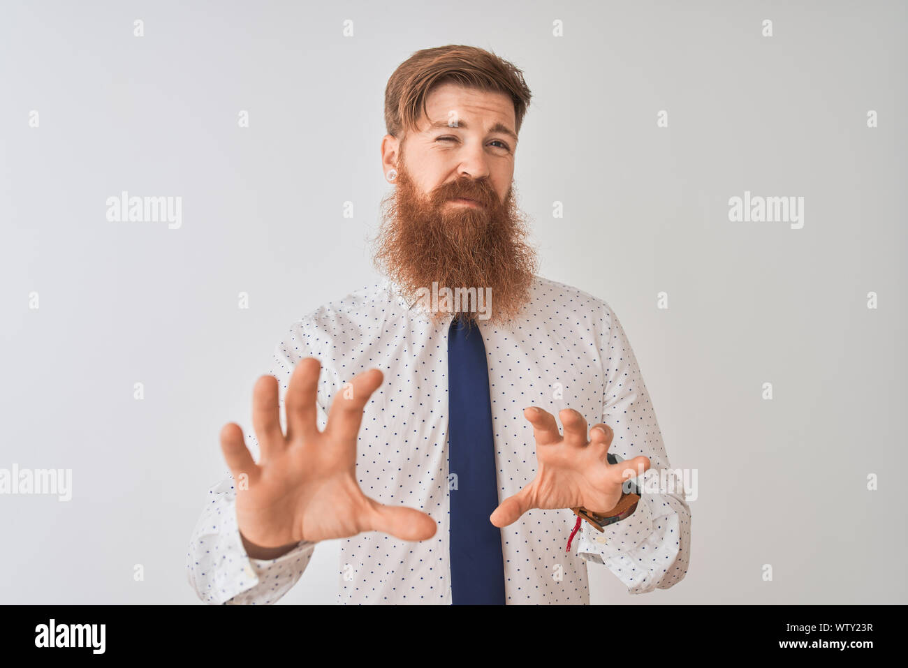 Young redhead irish businessman standing over isolated white background ...