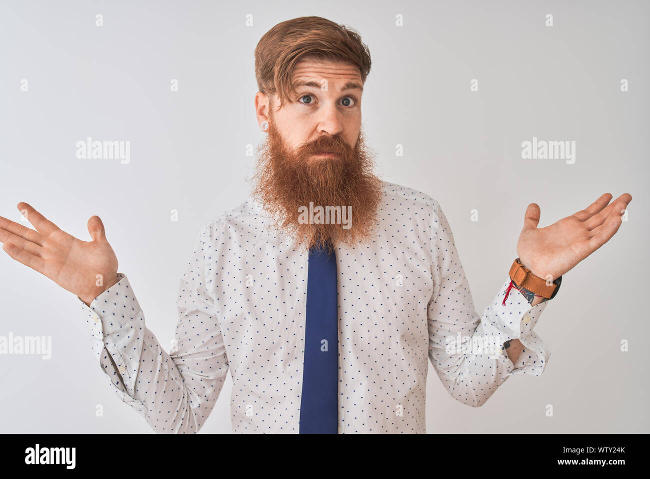 Young redhead irish businessman standing over isolated white background ...