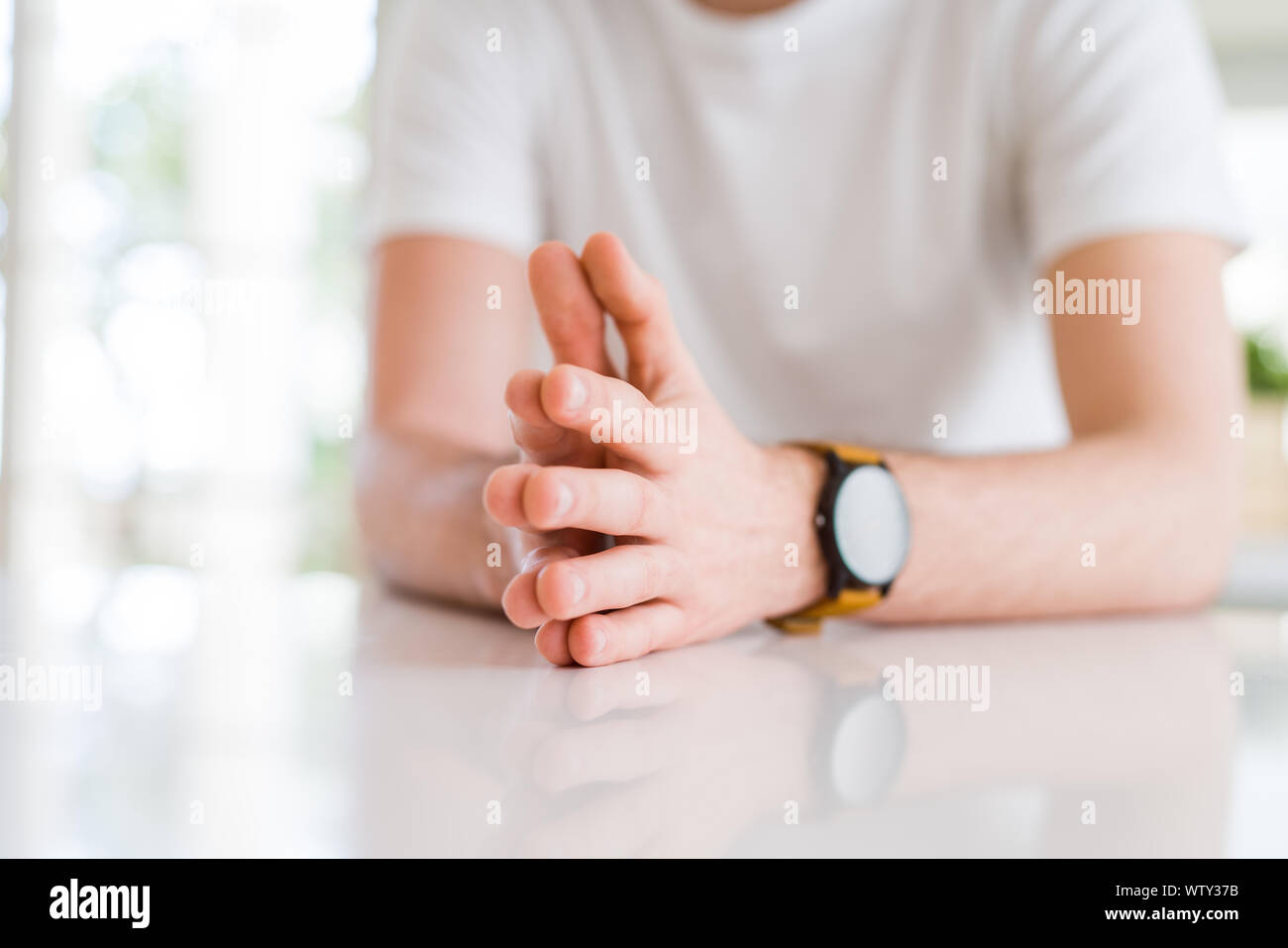 Close up young man hands together Stock Photo - Alamy