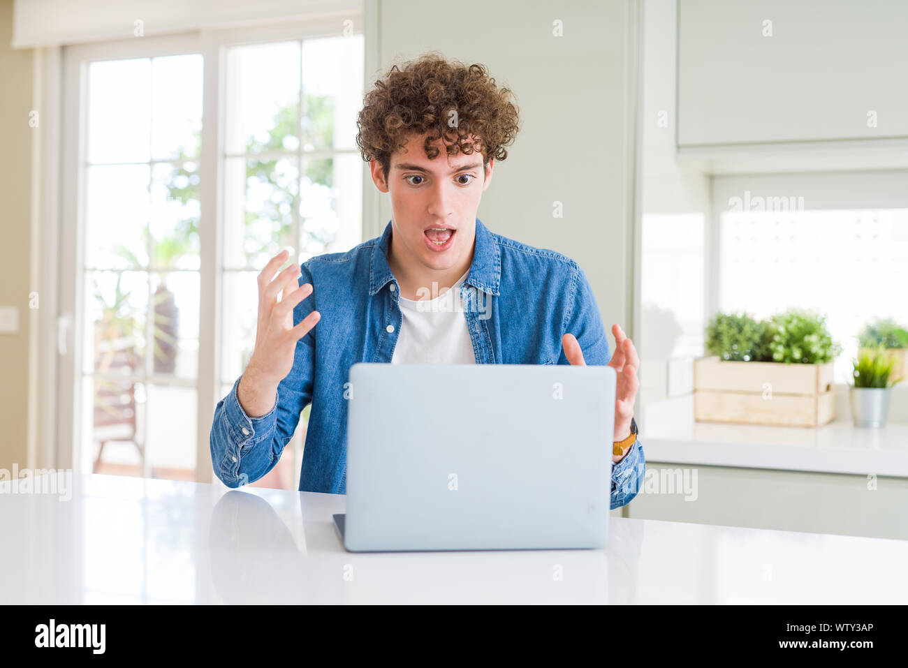 Young man using computer laptop very happy and excited, winner ...