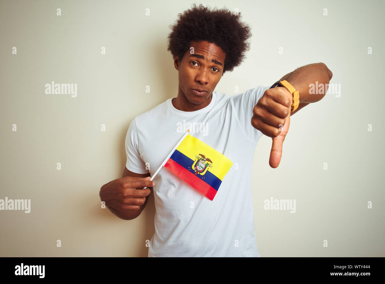 Afro american man holding Colombia Colombian flag standing over ...
