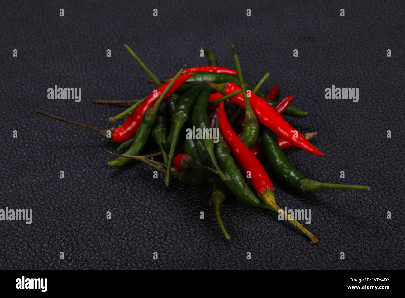 Ripe Hot and spicy Chili pepper heap Stock Photo - Alamy
