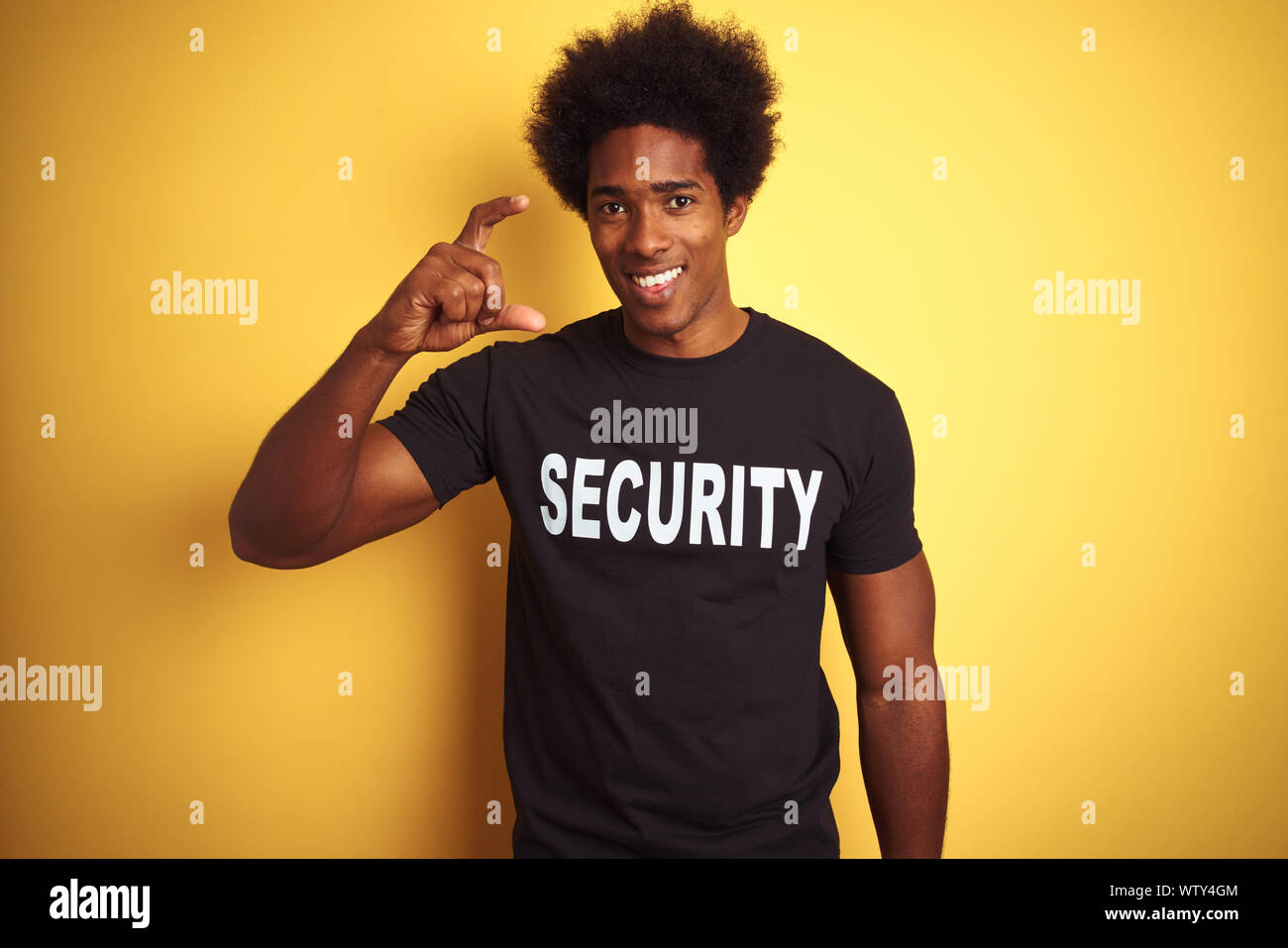 American safeguard man with afro hair wearing security uniform over ...