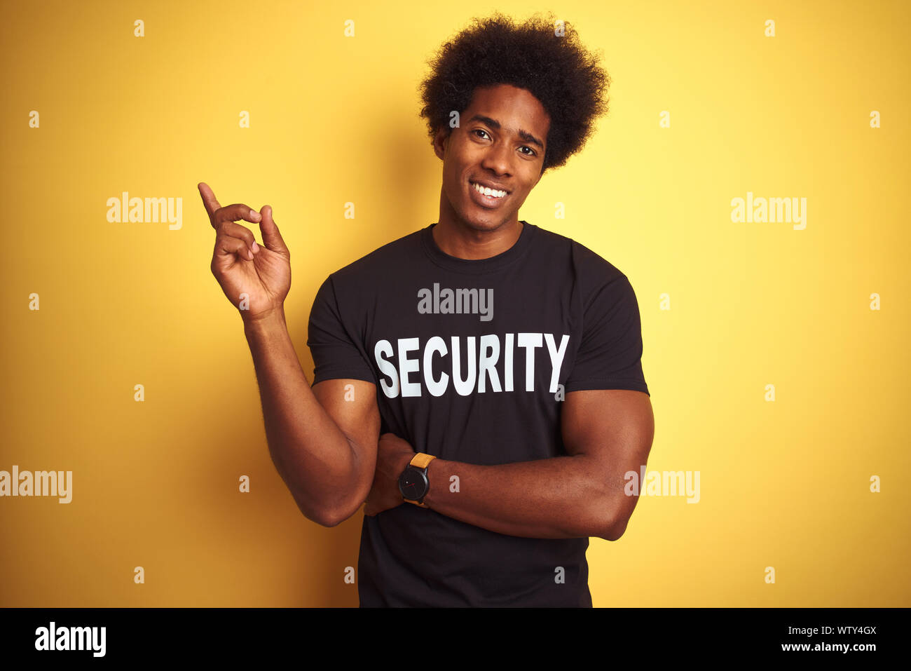 American safeguard man with afro hair wearing security uniform over ...