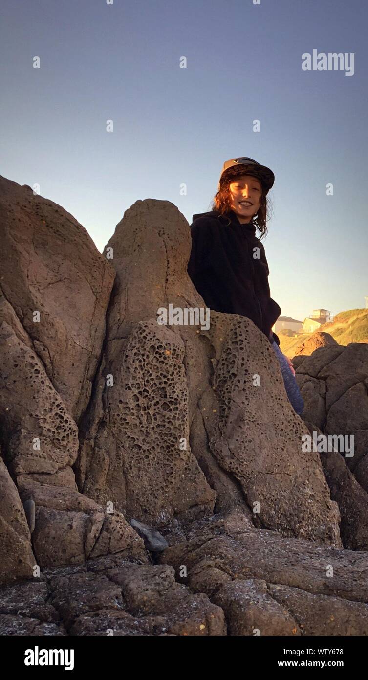 Boy Leaning On Rock Formation High Resolution Stock Photography and ...
