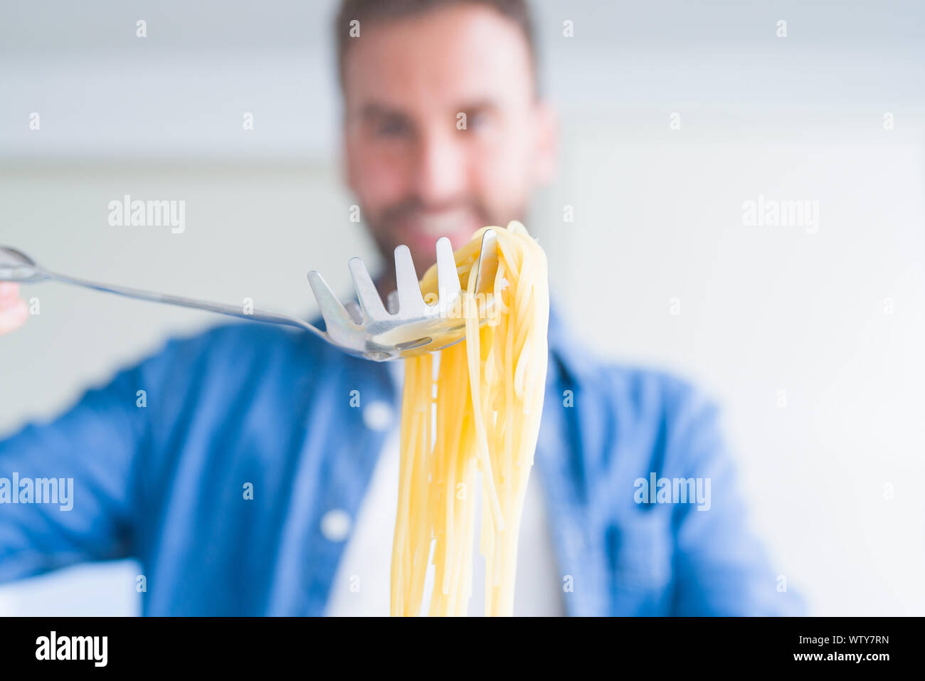 Hispanic boy eating pasta hi-res stock photography and images - Alamy