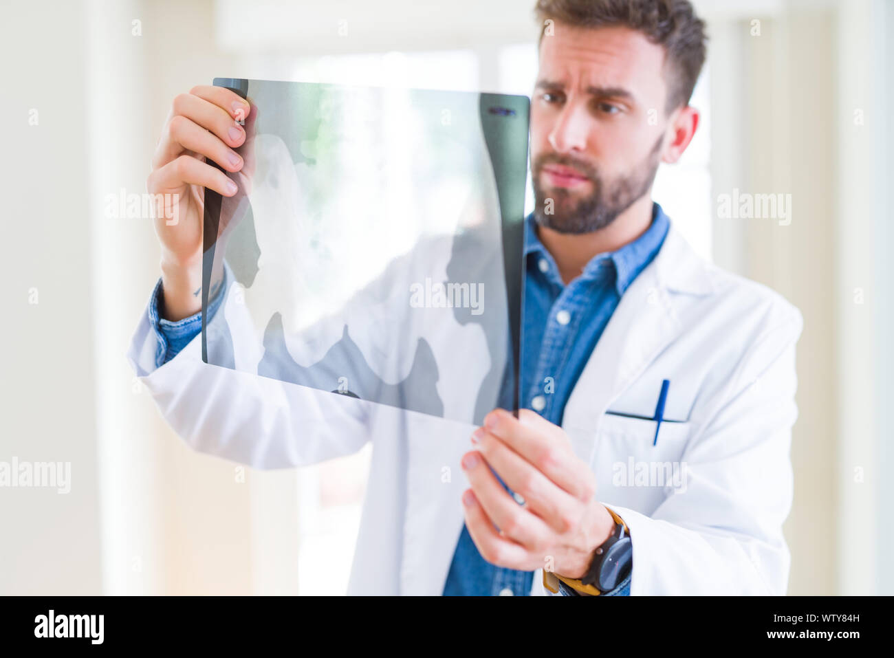 Doctor man looking at x-ray radiography doing body examination Stock ...
