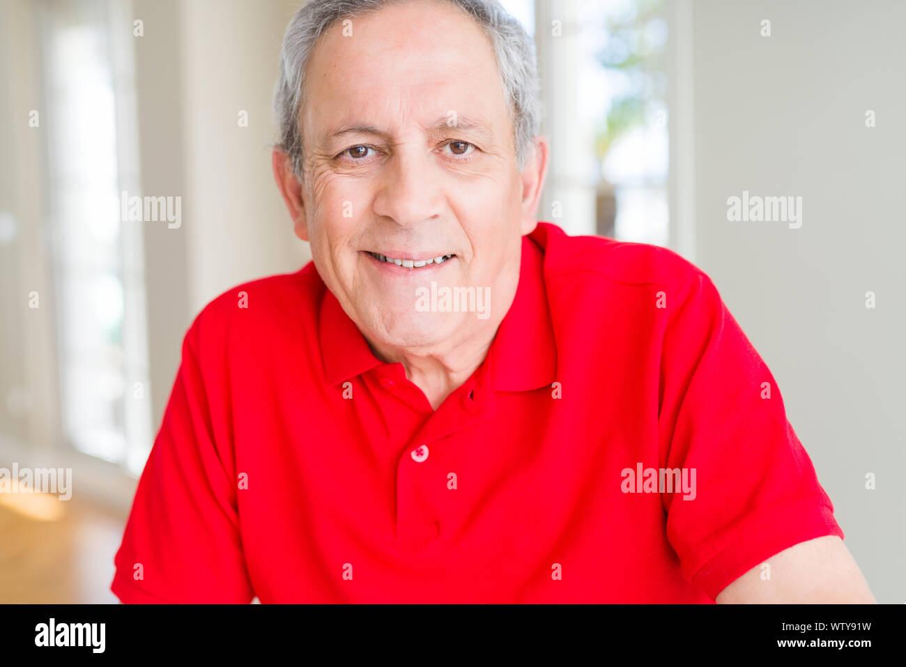 Handsome senior man smiling confident Stock Photo - Alamy