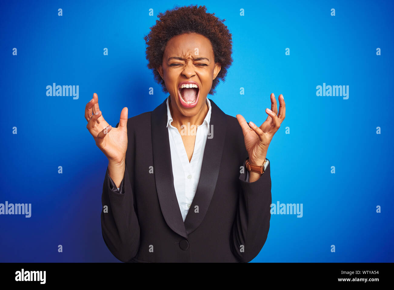 African american business executive woman over isolated blue background ...