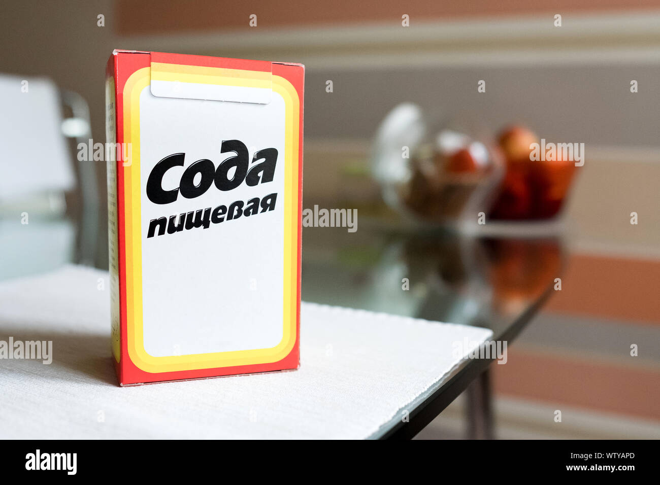 Baking soda in a paper box. Branded packaging of soda in the kitchen ...
