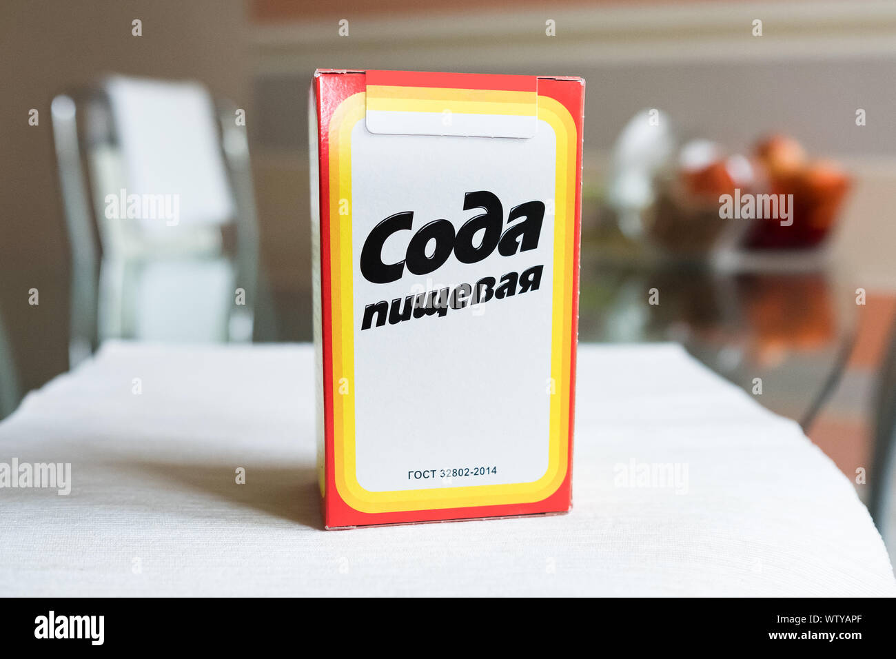 Baking soda in a paper box. Branded packaging of soda in the kitchen ...