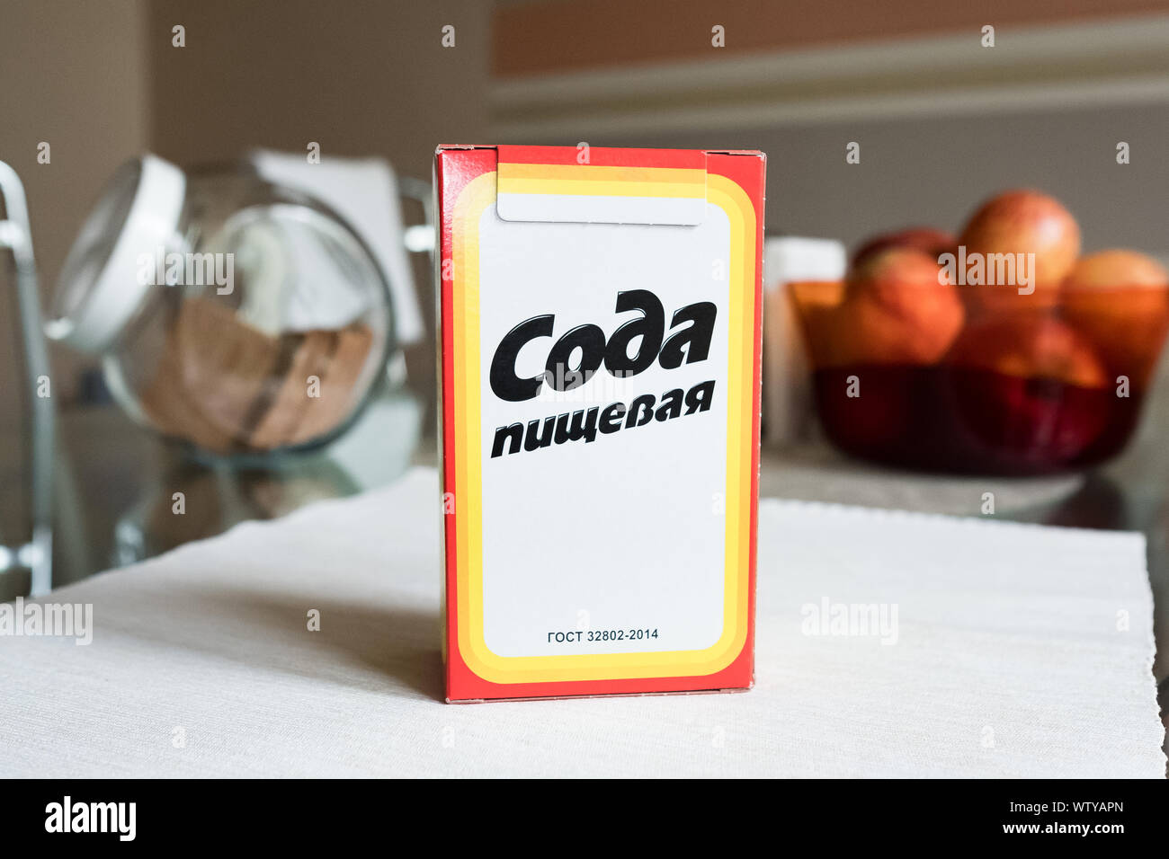 Baking soda in a paper box. Branded packaging of soda in the kitchen ...