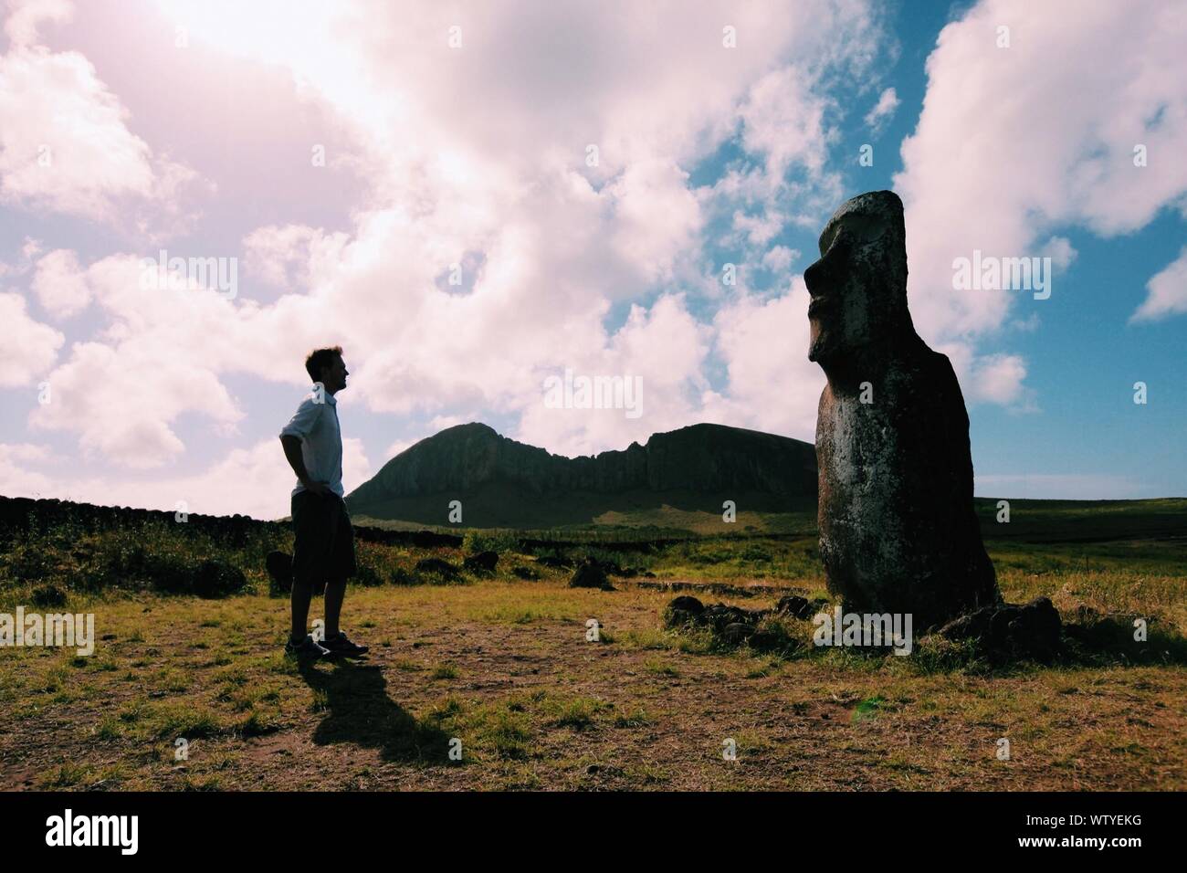 Person standing in front of moai hi-res stock photography and images ...