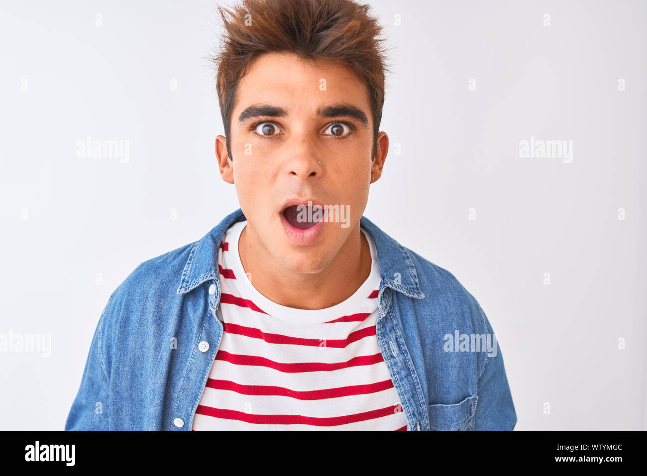 Young Handsome Man Wearing Striped T Shirt And Denim Shirt Over