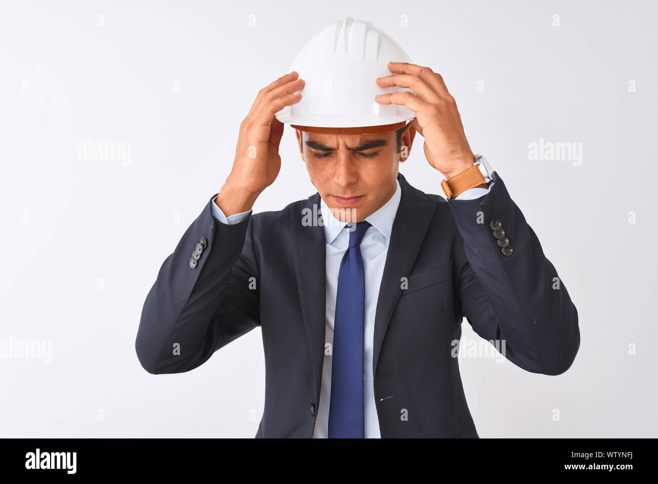 Young handsome architect man wearing suit and helmet over isolated ...