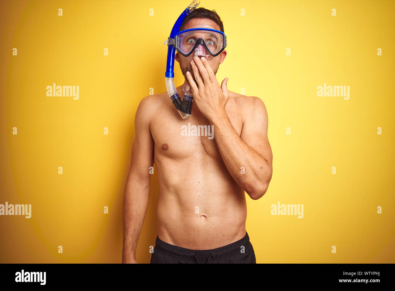 Young handsome shirtless man wearing diving goggles over isolated ... Young handsome shirtless man wearing diving goggles over isolated ...