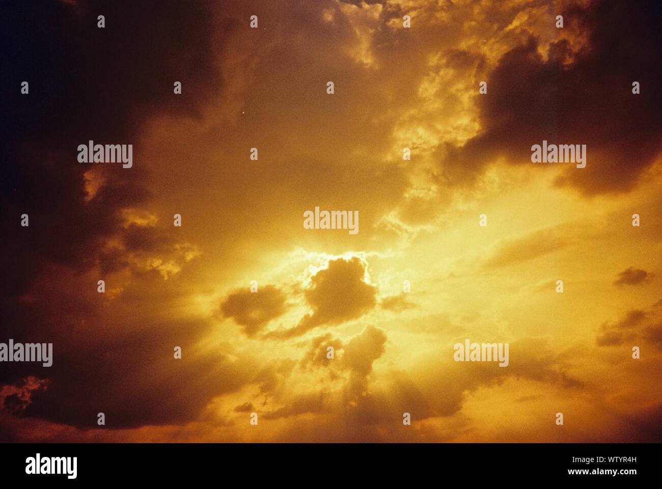 Clouds with light shining through them hi-res stock photography and ...